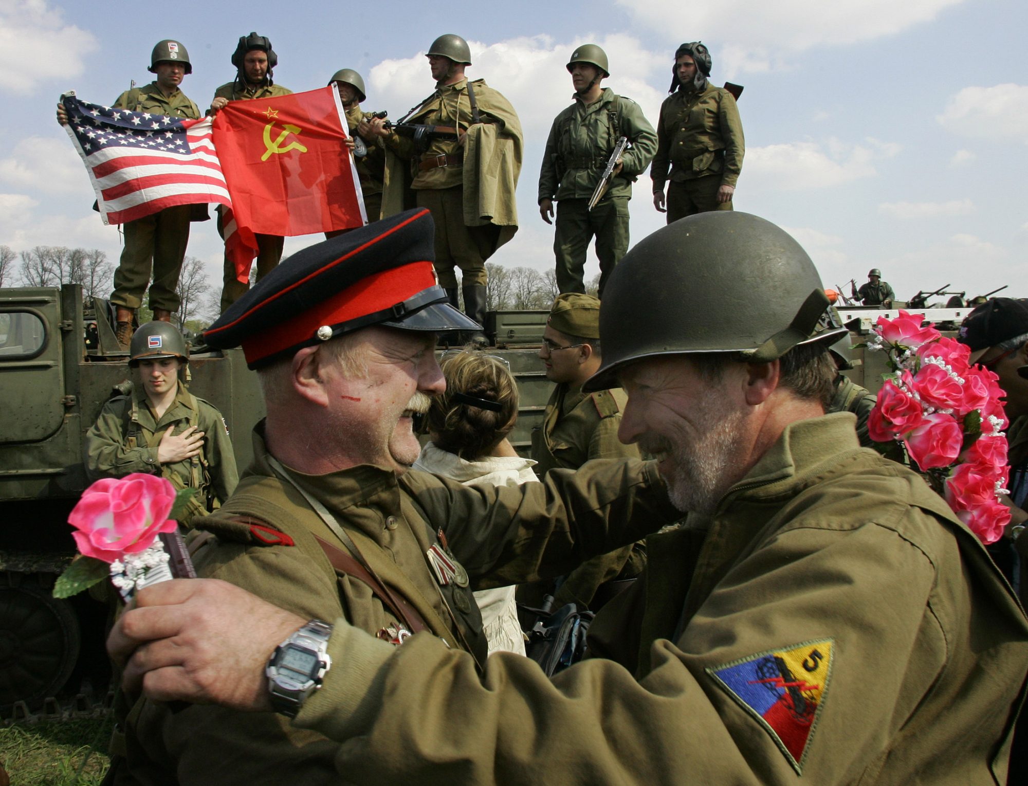 Putin woos Trump with WWII nostalgia but Russia's hybrid war continues ...